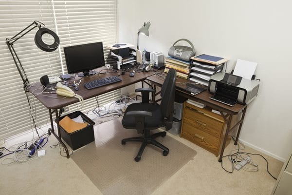 messy extension cords in a home office | innovate building solutions ...